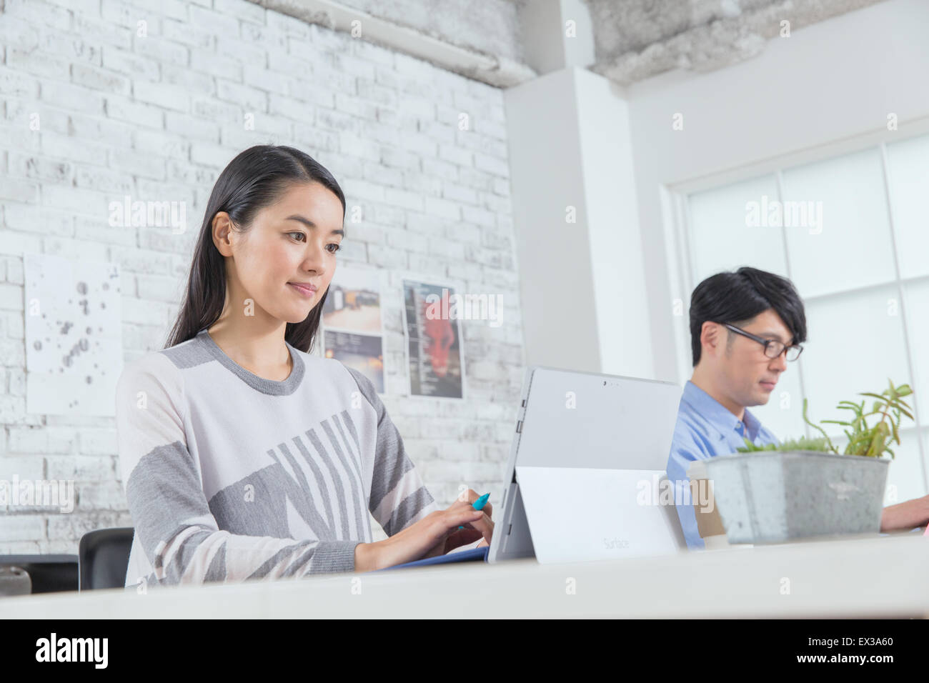 Japanese people working in modern office Stock Photo - Alamy
