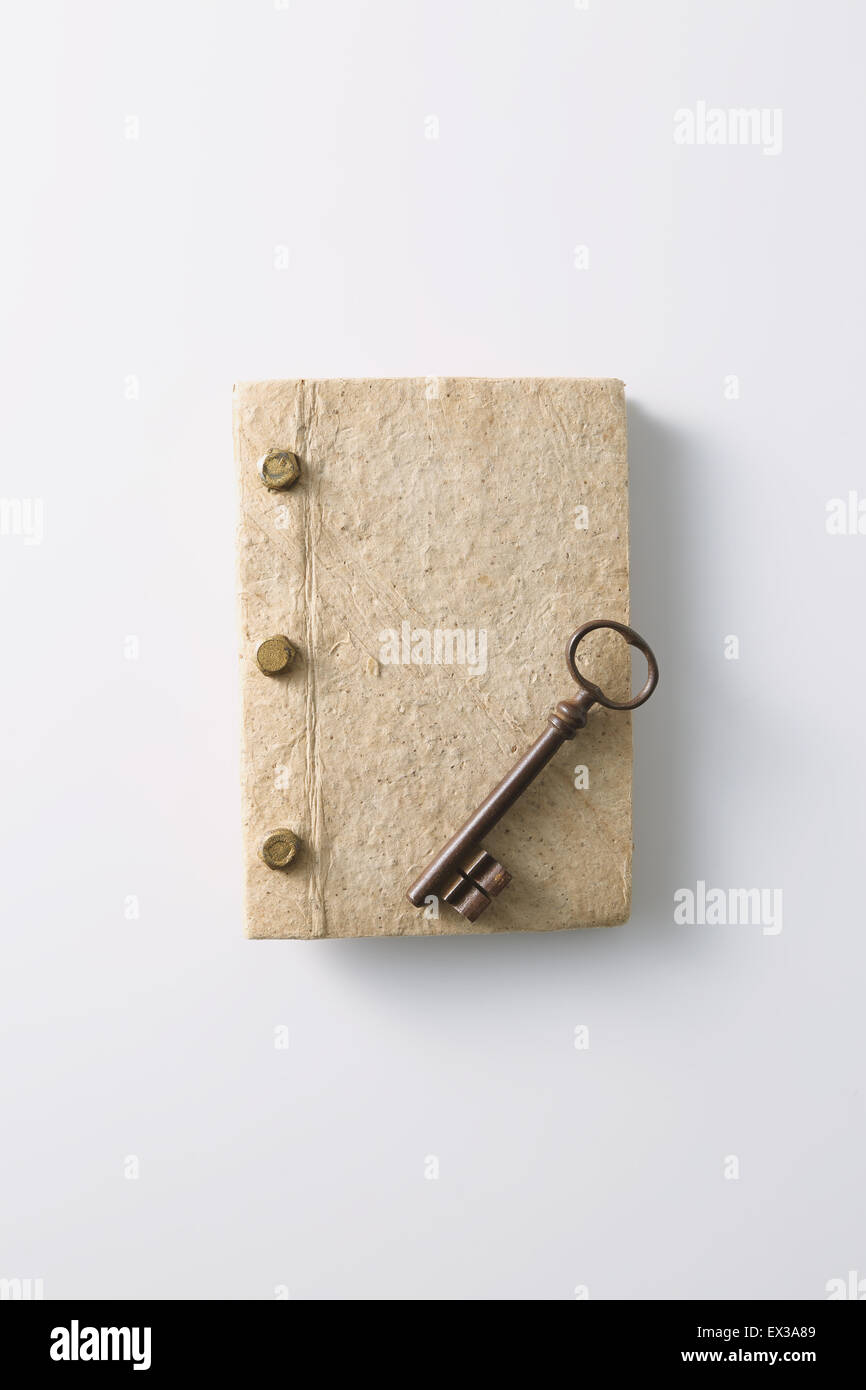 Vintage key and book Stock Photo - Alamy