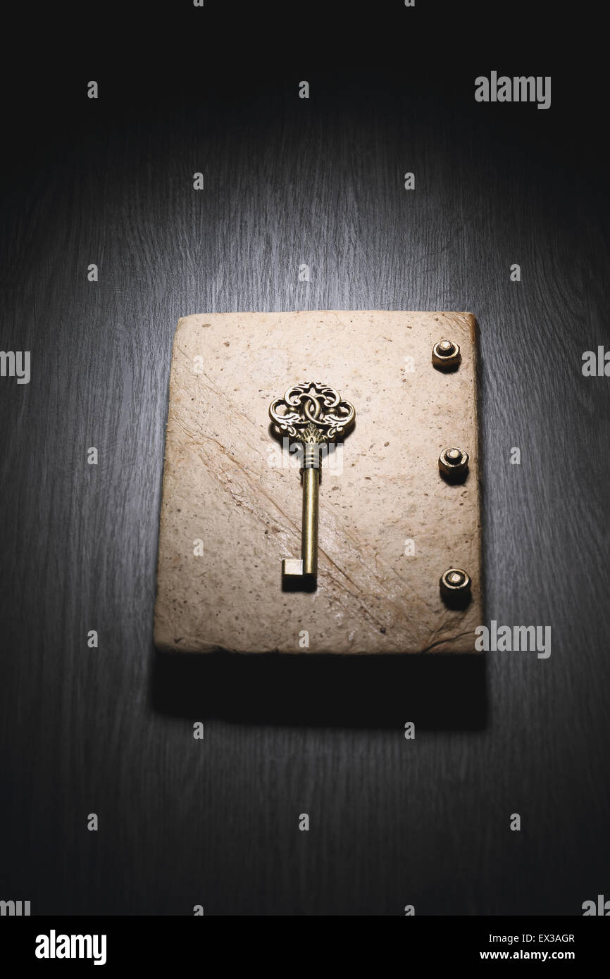 Vintage key and book Stock Photo - Alamy