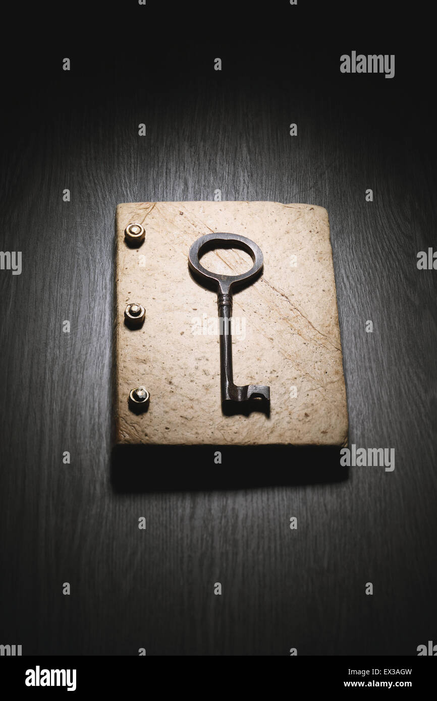 Vintage key and book Stock Photo - Alamy