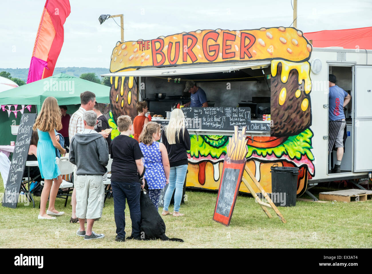 Queue of people at a burger van mobile kiosk Eastbourne Sussex England ...