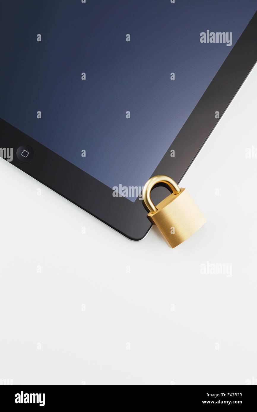 Safety lock and tablet Stock Photo - Alamy