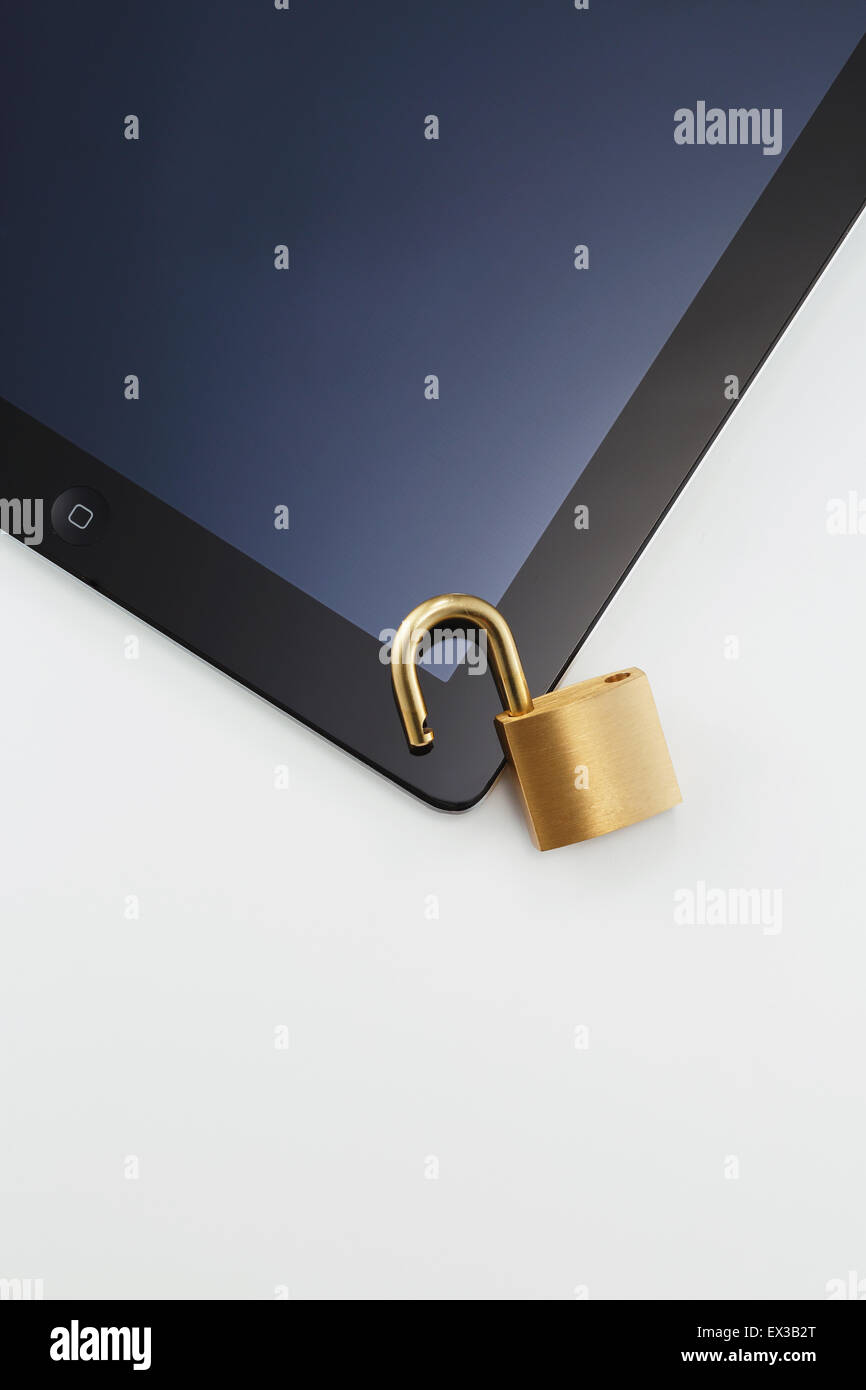 Safety lock and tablet Stock Photo - Alamy
