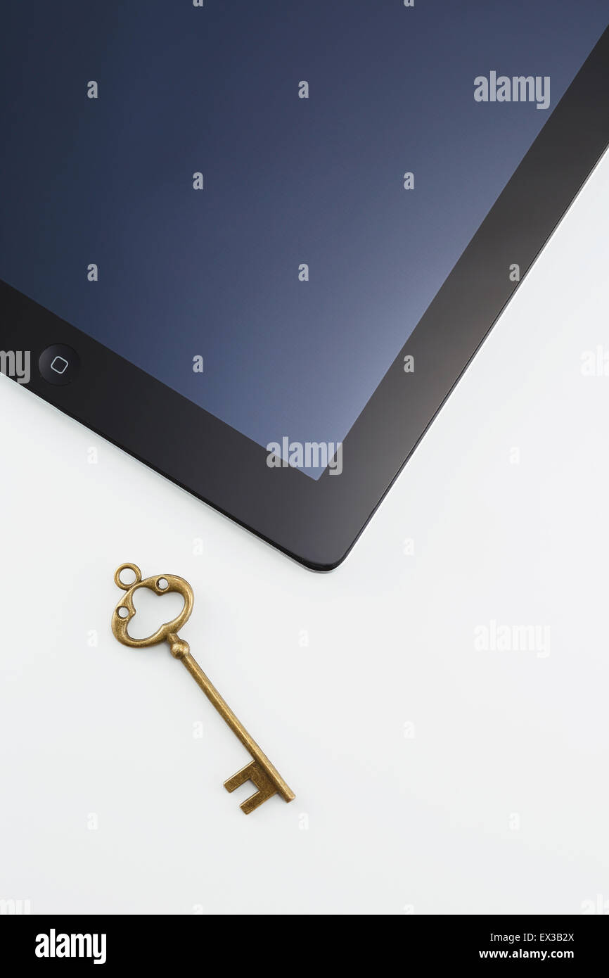 Key and tablet Stock Photo - Alamy