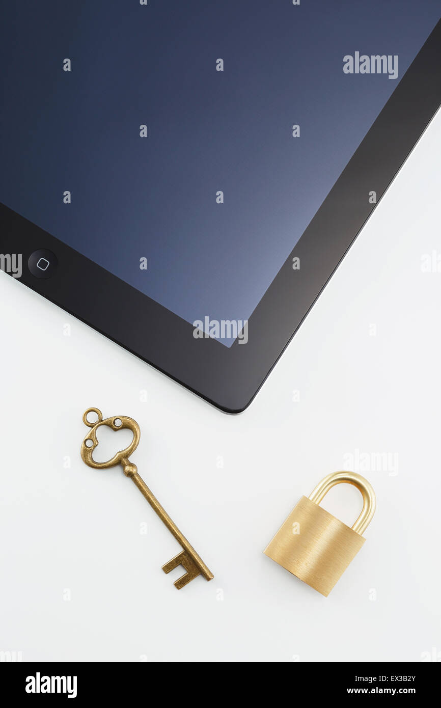 Key safety lock and tablet Stock Photo - Alamy