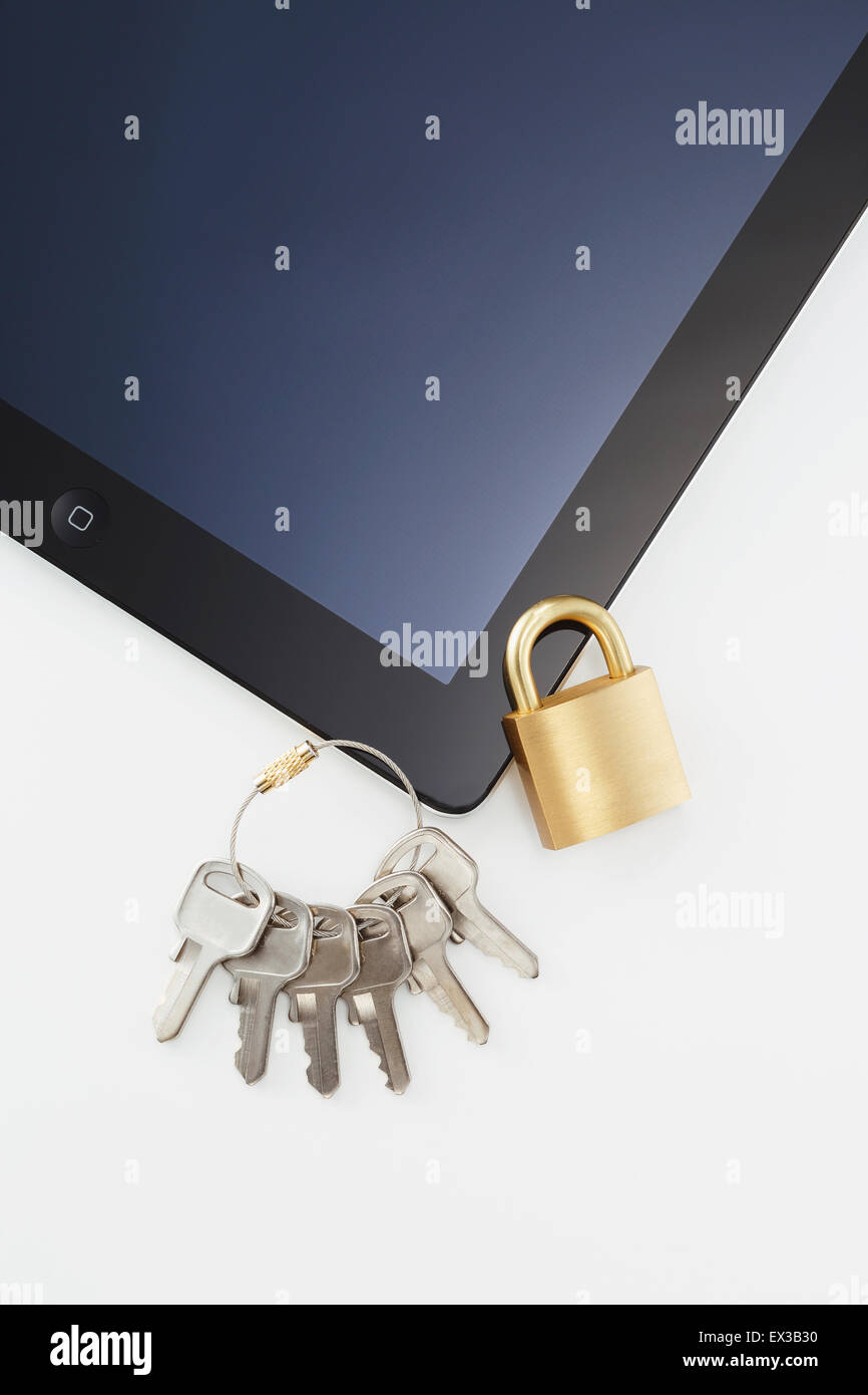 Keys safety lock and tablet Stock Photo - Alamy