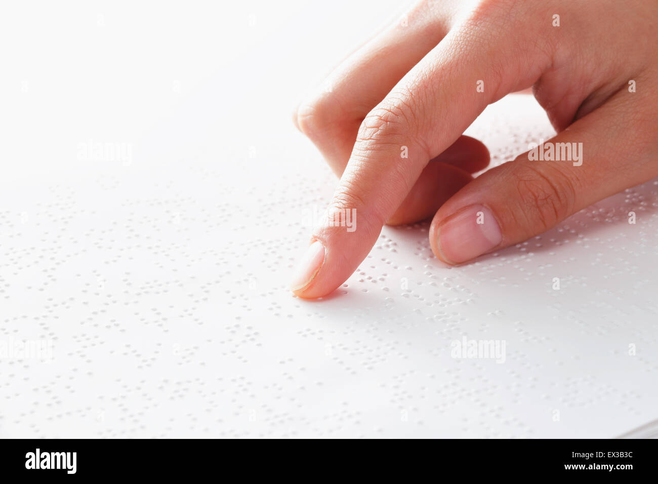 Hand reading Braille paper Stock Photo - Alamy
