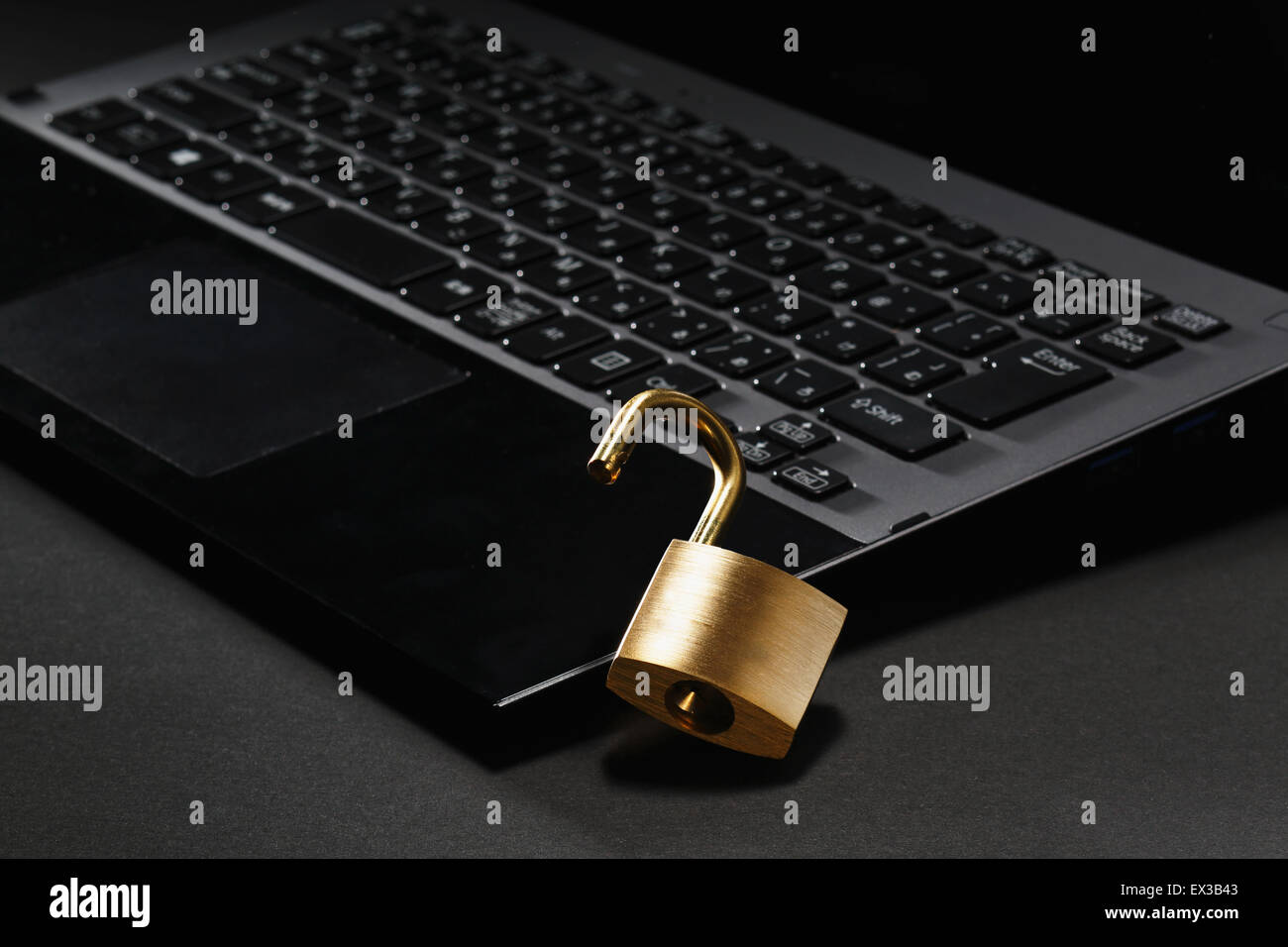Safety lock and laptop Stock Photo - Alamy