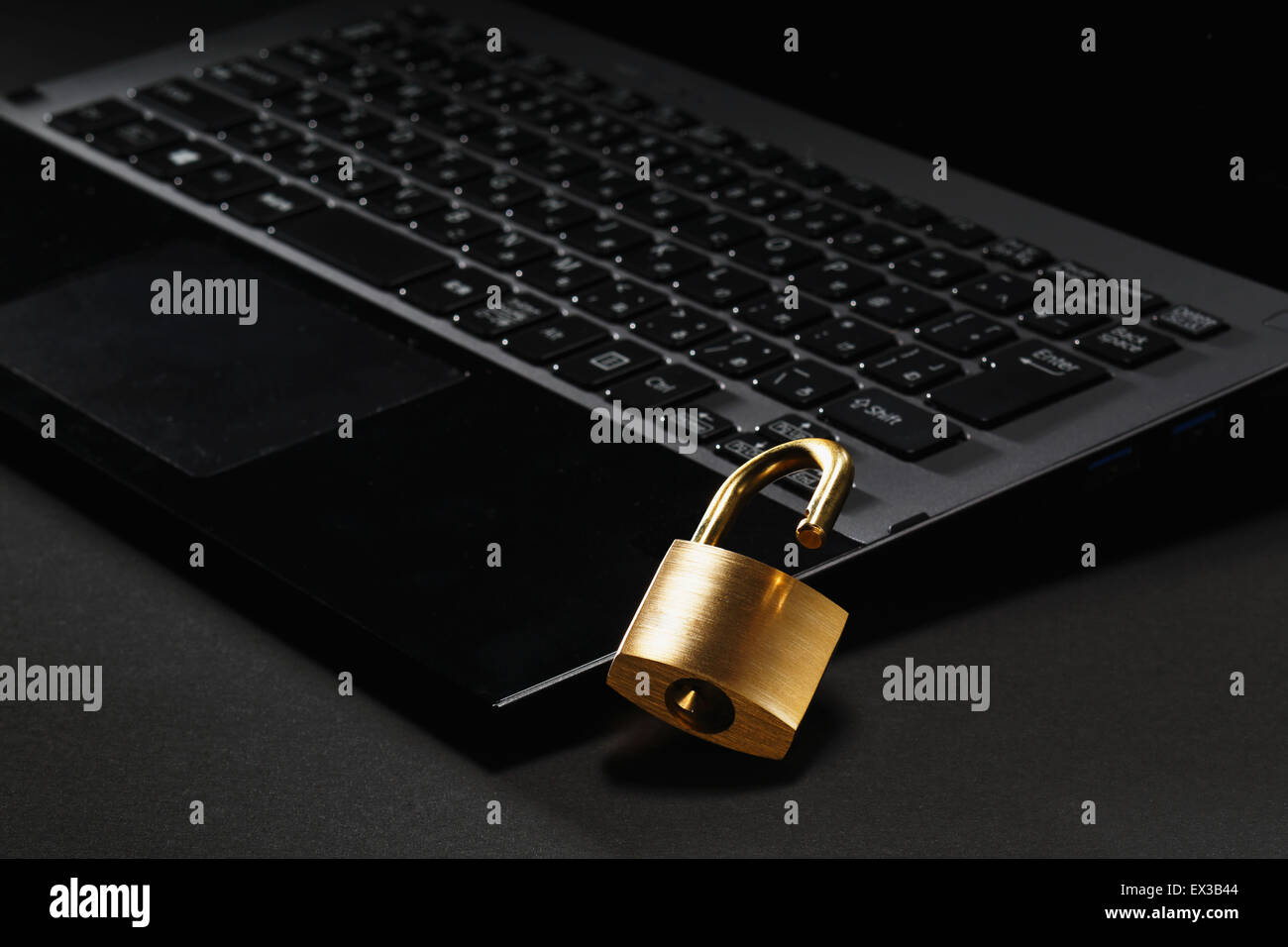 Safety lock and laptop Stock Photo - Alamy