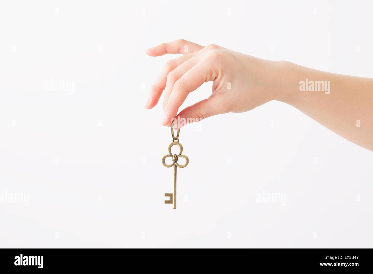 Young woman holding key Stock Photo - Alamy