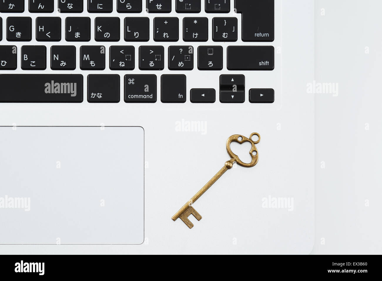 Key and laptop Stock Photo - Alamy