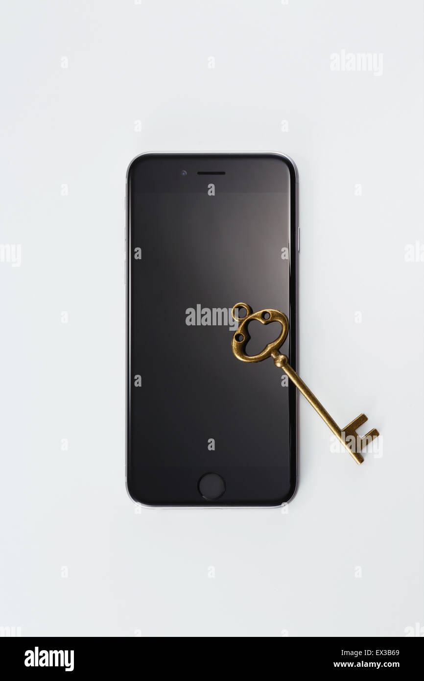 Key and smartphone Stock Photo - Alamy