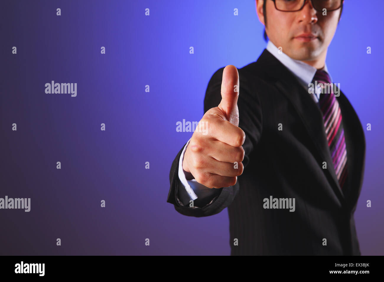 Japanese businessman giving the thumbs-up Stock Photo - Alamy