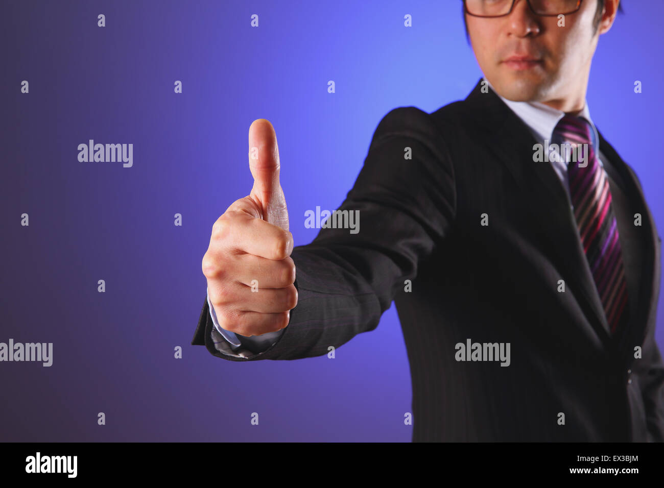 Japanese businessman giving the thumbs-up Stock Photo - Alamy