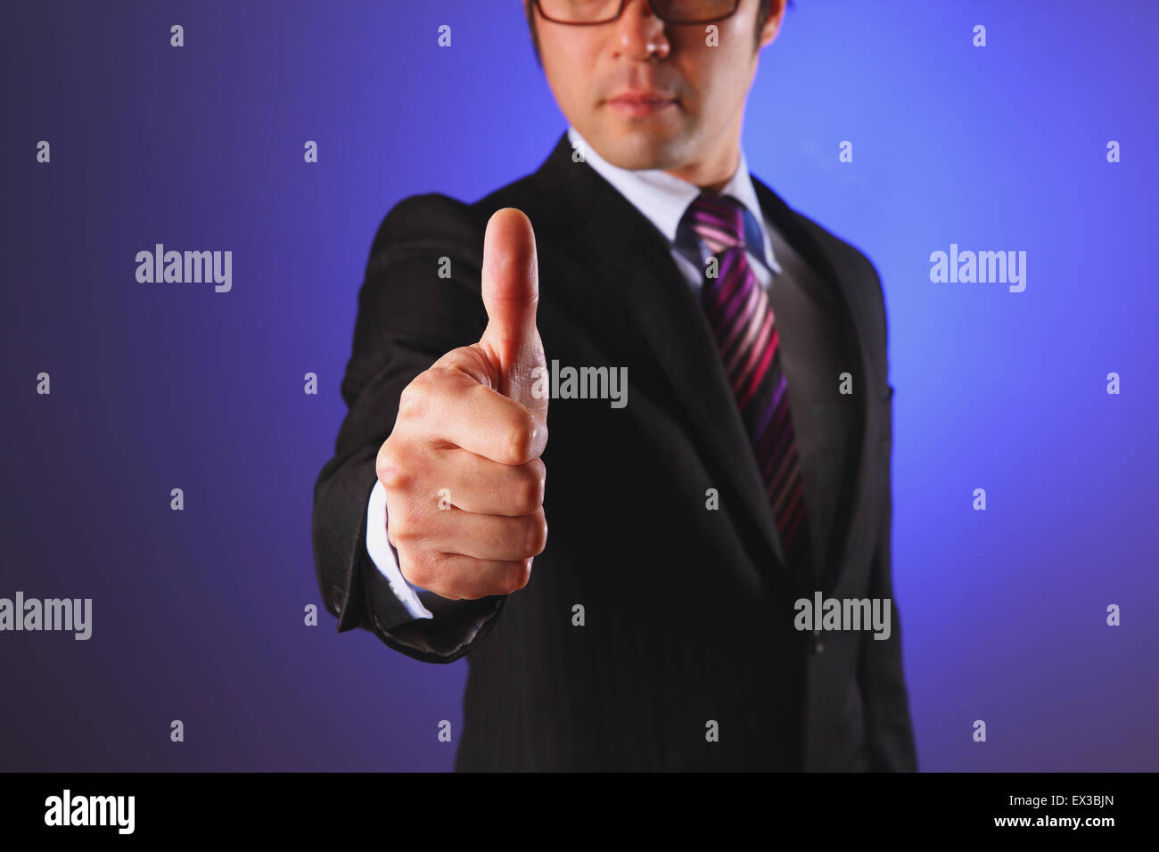 Japanese businessman giving the thumbs-up Stock Photo - Alamy