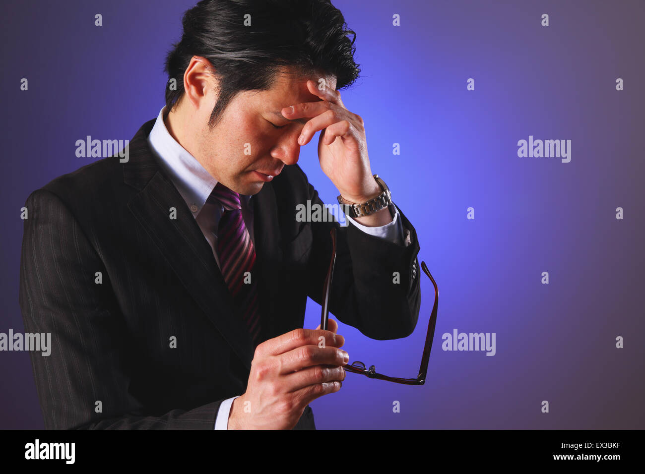 Tired Japanese businessman Stock Photo - Alamy