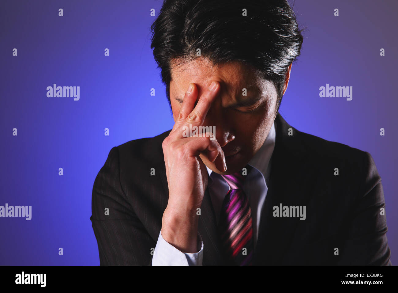 Tired Japanese businessman Stock Photo - Alamy