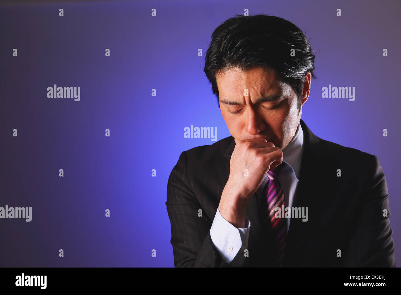 Tired Japanese businessman Stock Photo - Alamy