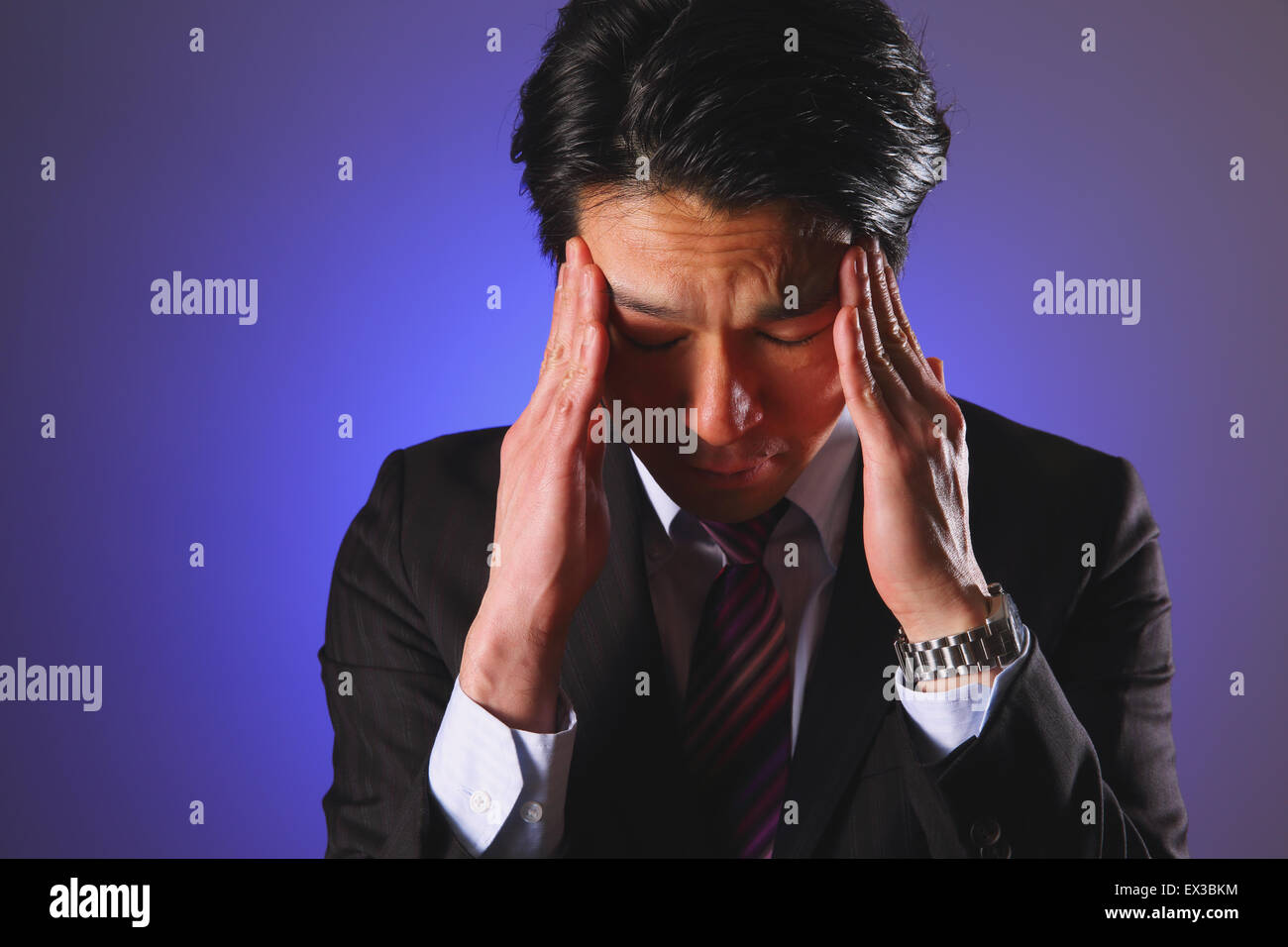 Tired Japanese businessman Stock Photo - Alamy