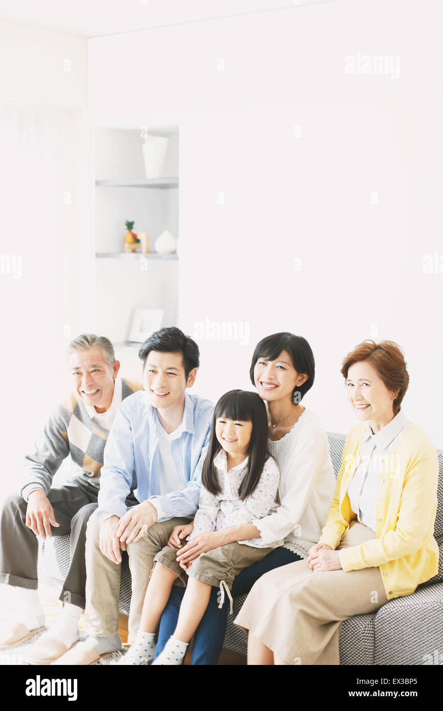 Three-generation Japanese family on the sofa in the living room Stock ...