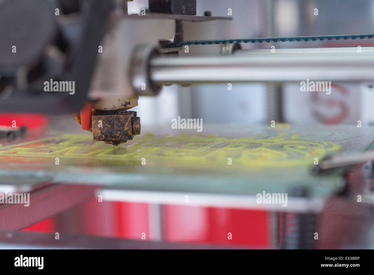 Yellow plastic piece printed in a 3D printer Stock Photo - Alamy