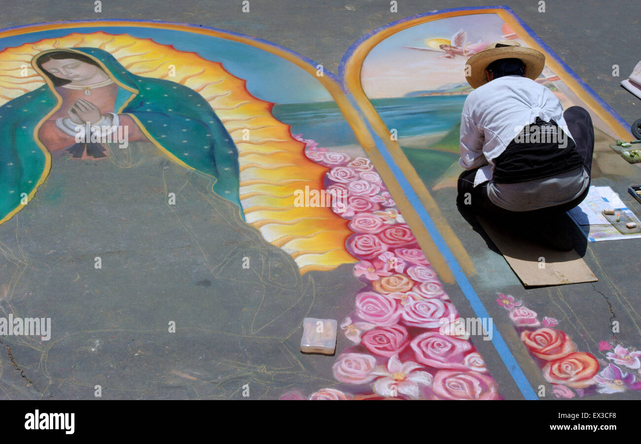 A woman artist painting with chalk at the "Old Santa Barbara Mission ...