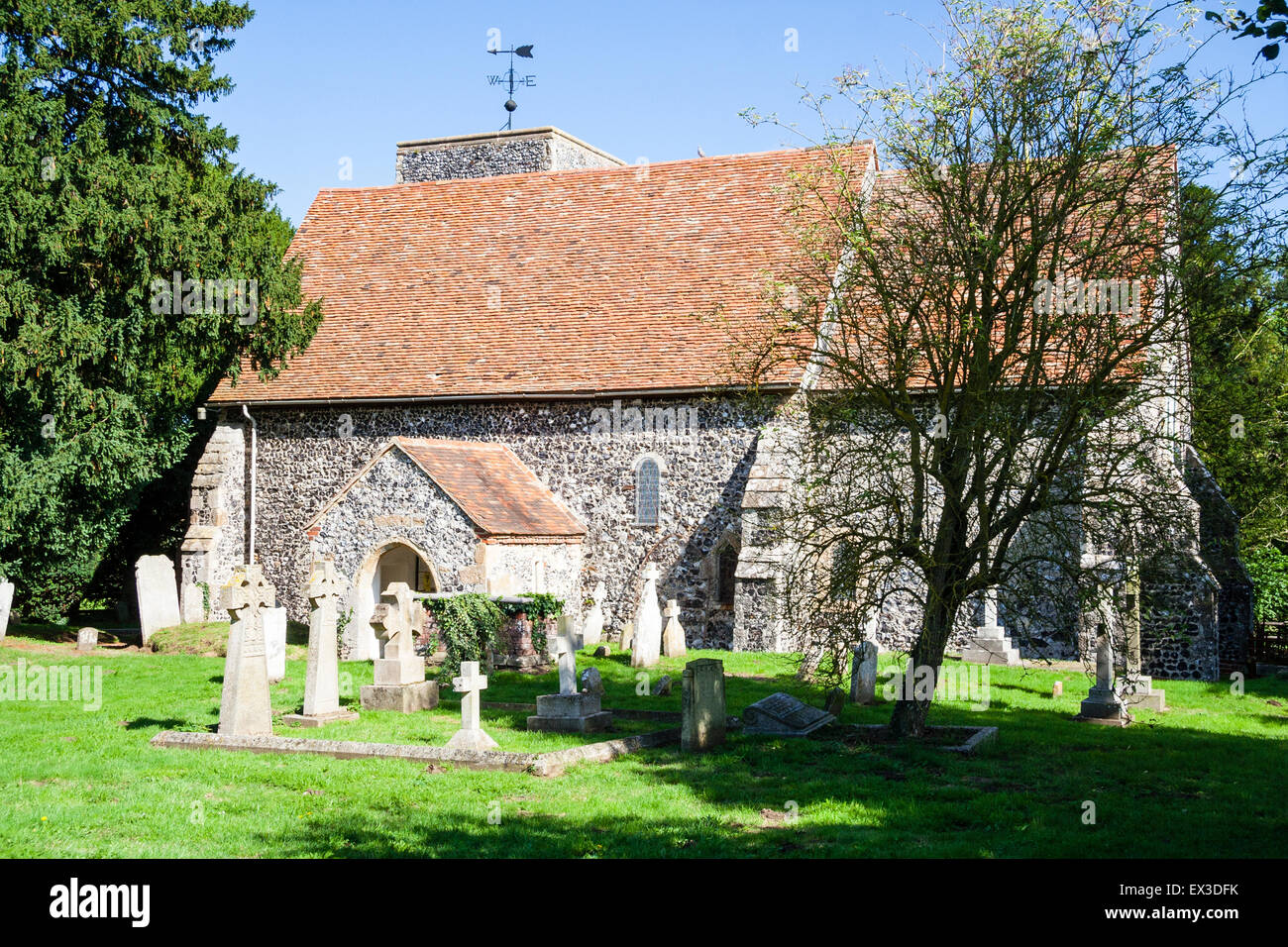 Elmstone Norman church in Kent, England. Stone building with tiled roof ...