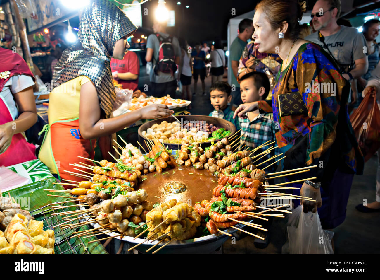 Stall with a large pot with skewers, cookshop, night market, Phuket ...