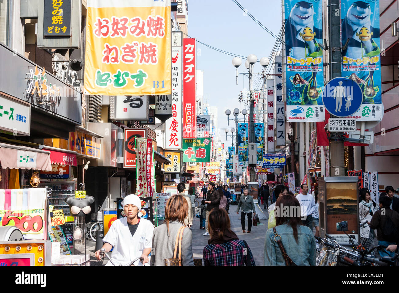 Crowded with people and tourists, the busy pedestrian precinct running ...