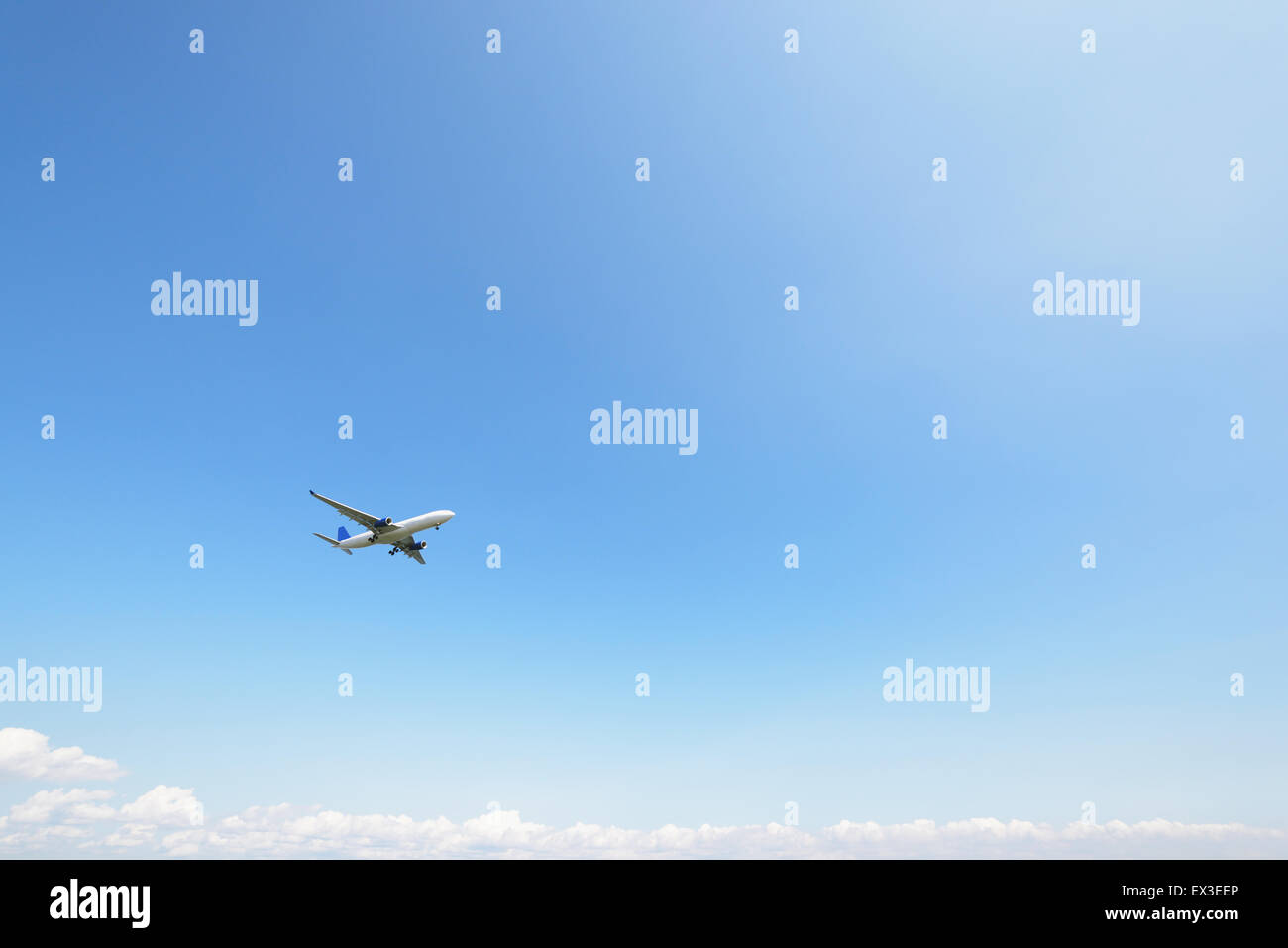 Airplane flying in the sky Stock Photo - Alamy