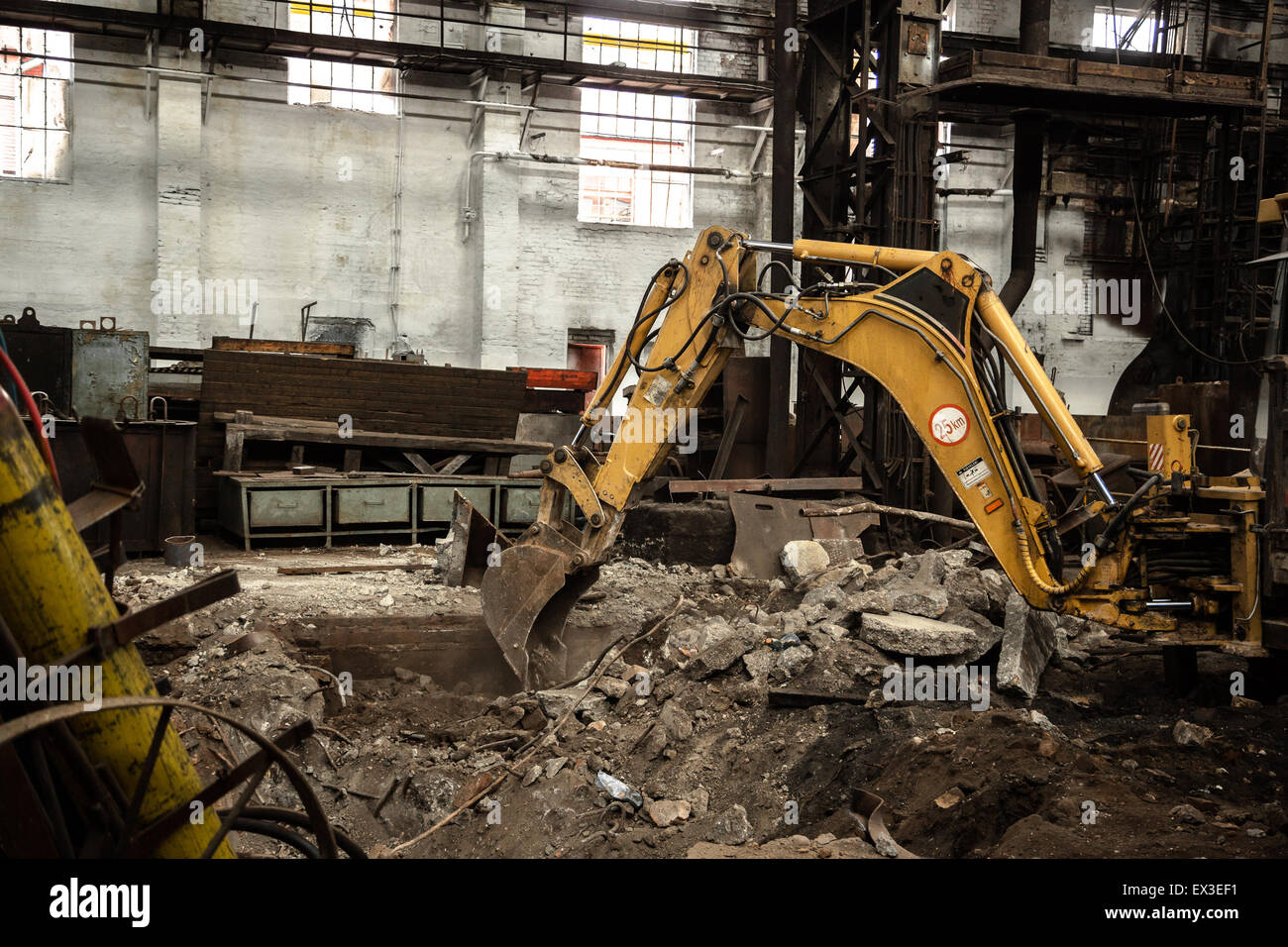 Industrial interior with bulldozer inside Stock Photo - Alamy