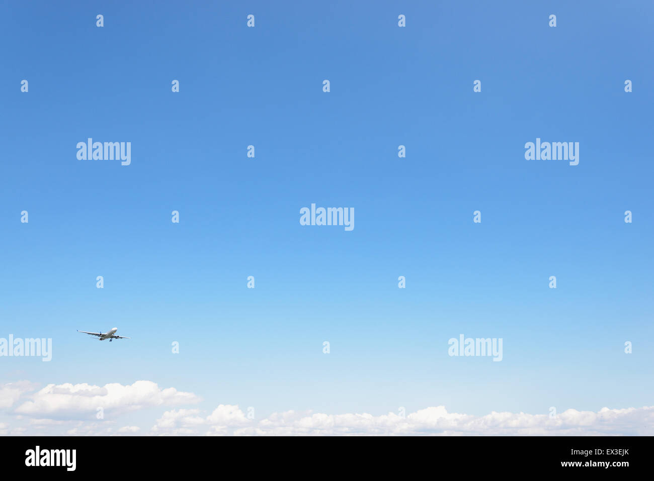 Airplane flying in the sky Stock Photo - Alamy