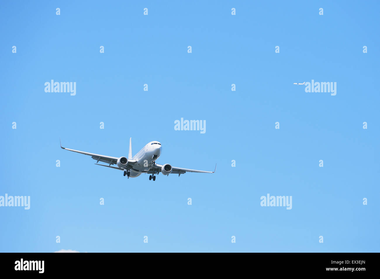 Airplane flying in the sky Stock Photo - Alamy