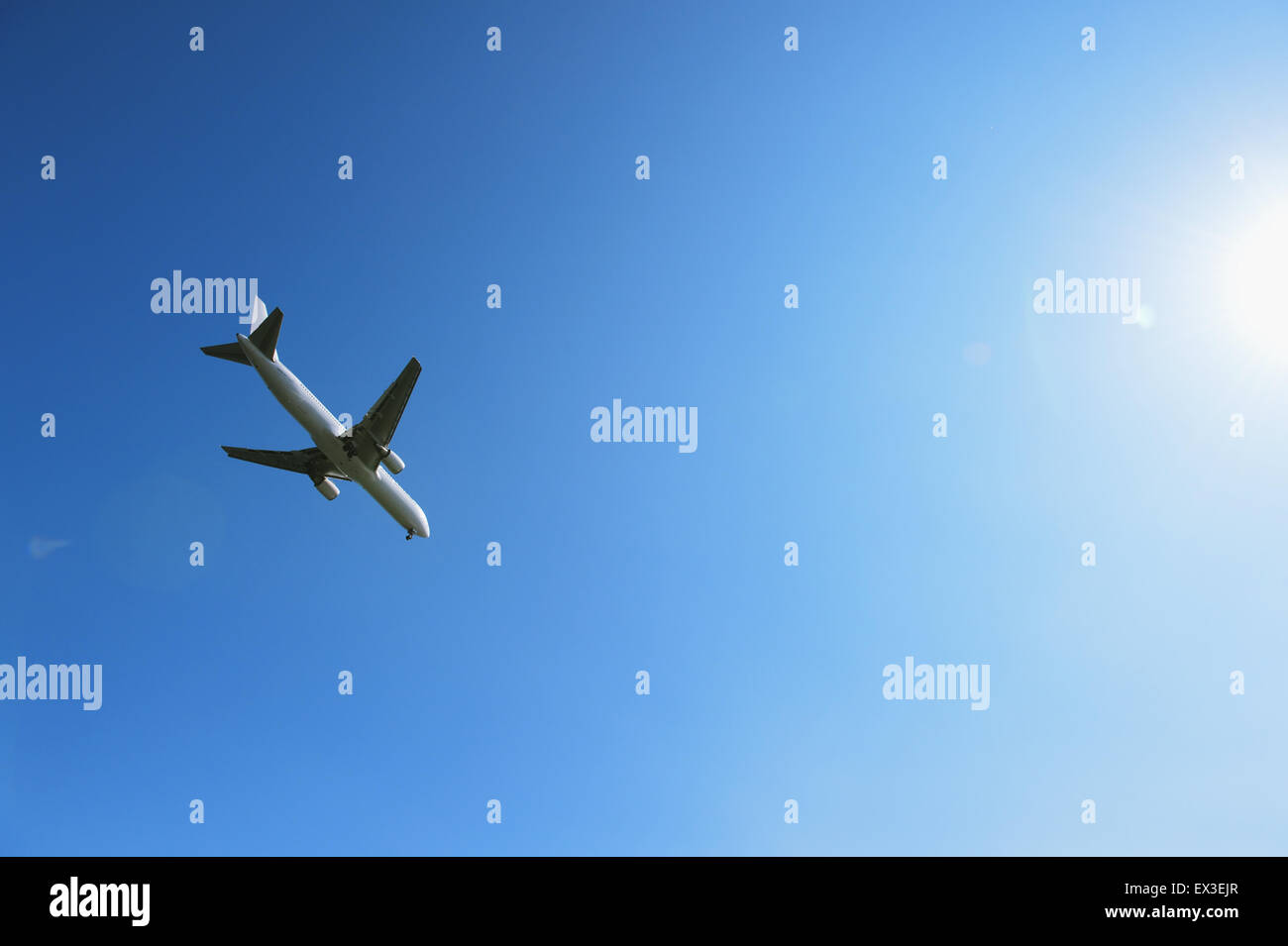 Airplane flying in the sky Stock Photo - Alamy