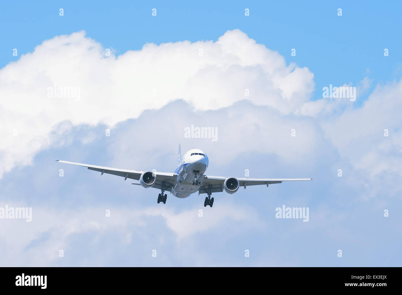 Airplane flying in the sky Stock Photo - Alamy