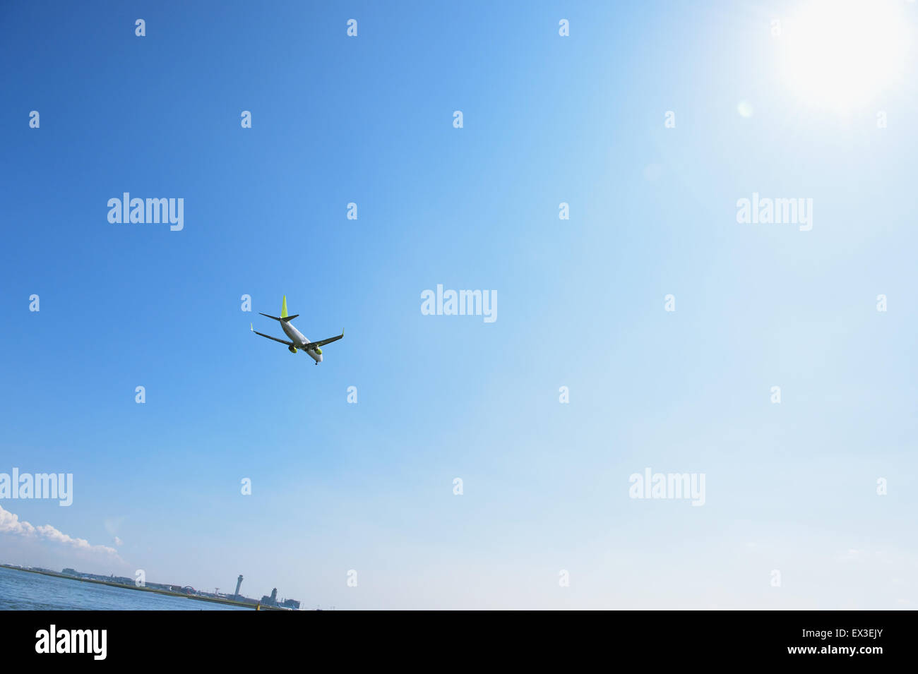 Airplane flying in the sky Stock Photo - Alamy