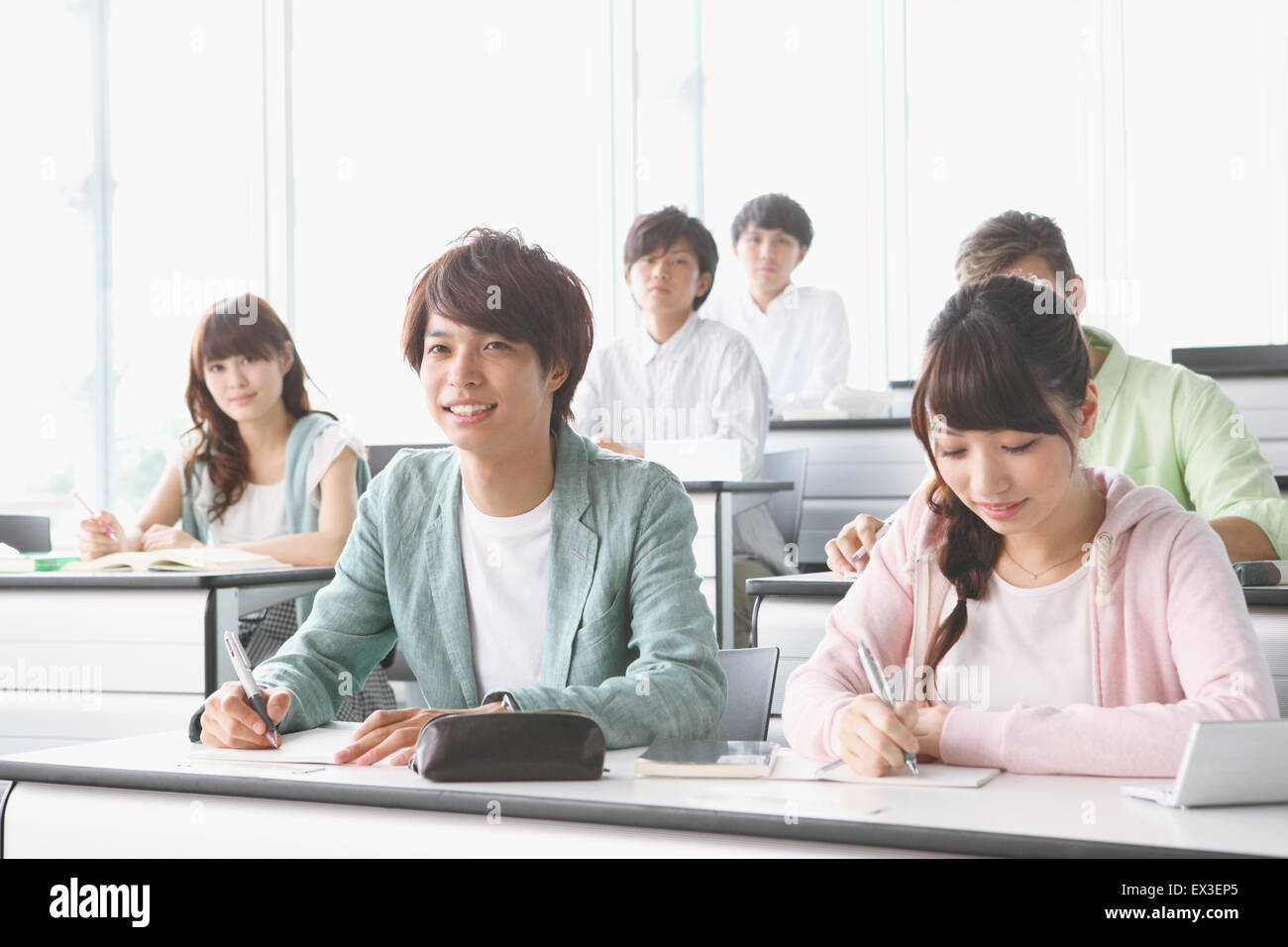 Group young people in classroom hi-res stock photography and images - Alamy