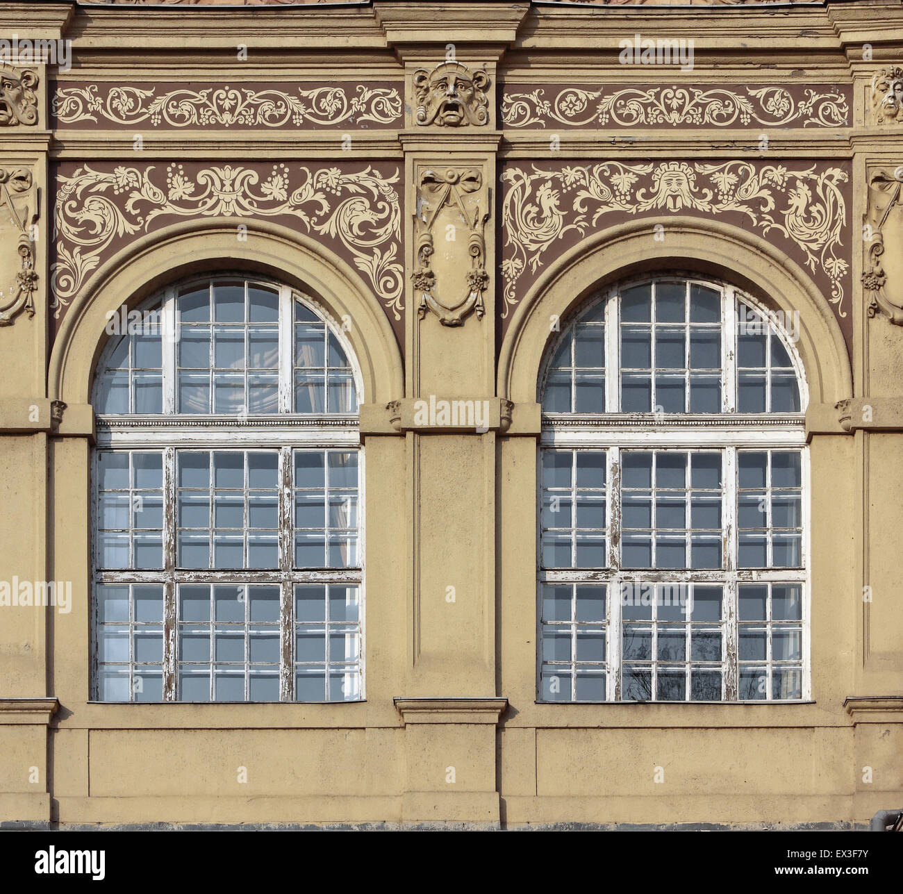 Historic mansion decorated with double windows Stock Photo - Alamy