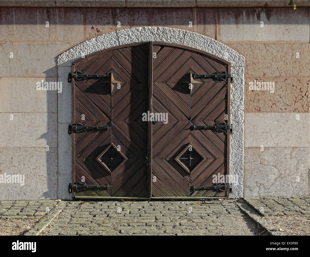 Medieval-style brown ornate vaulted wooden castle gate Stock Photo - Alamy