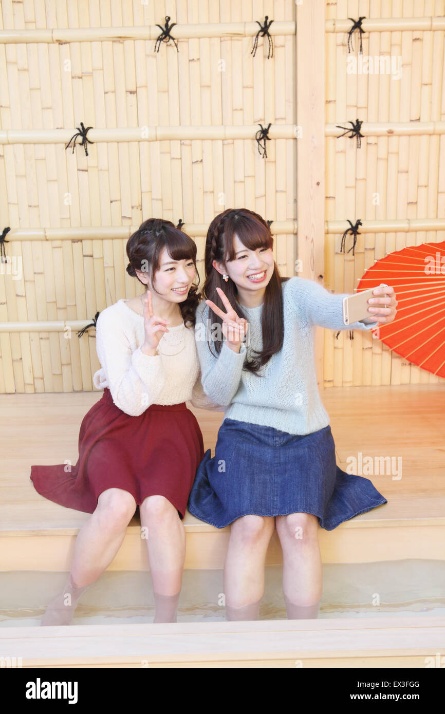 Young Japanese women enjoying foot spa in Kawagoe, Japan Stock Photo ...