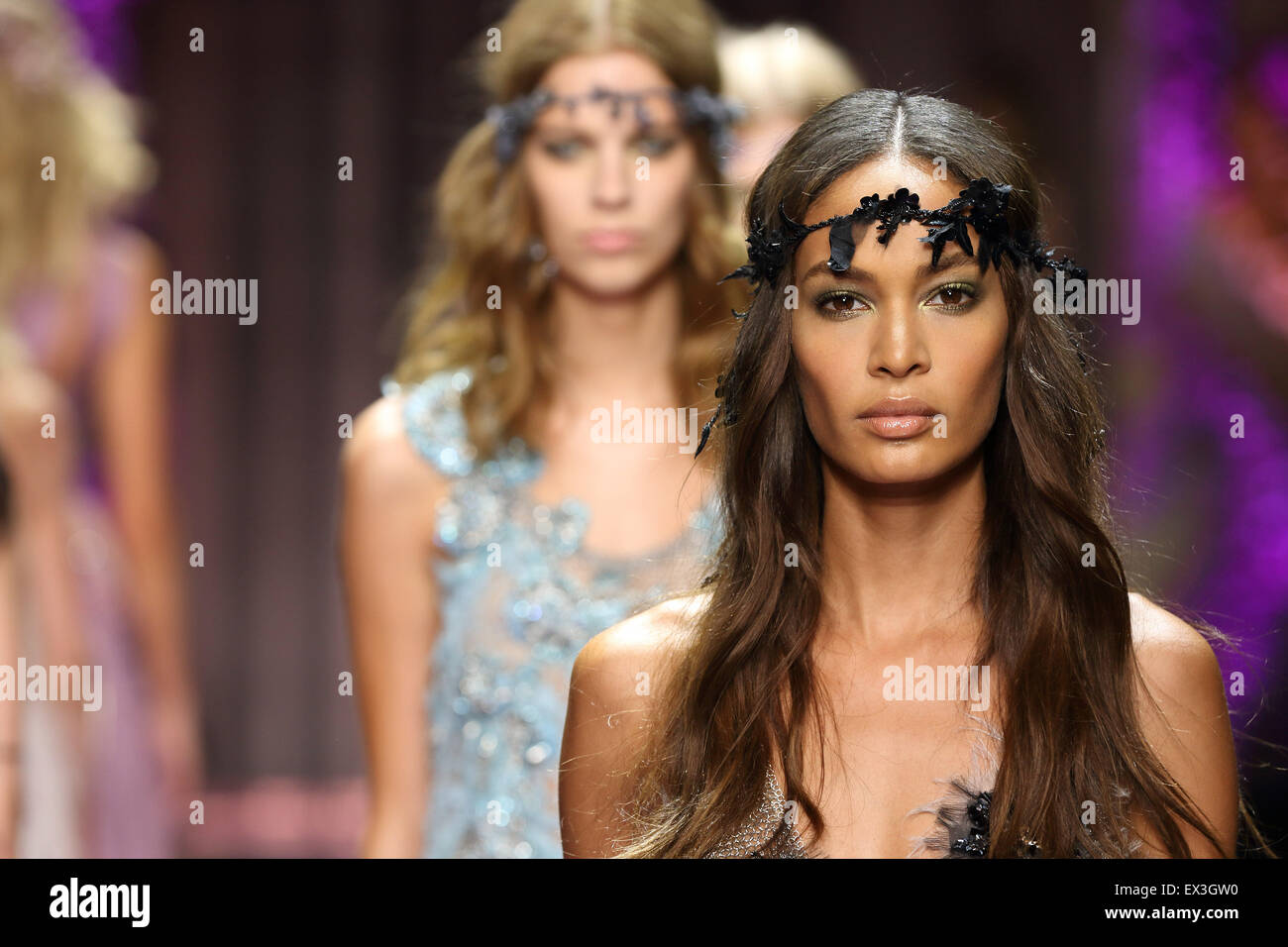 Models wear creations by Italian designer Donatella Versace as part of ...