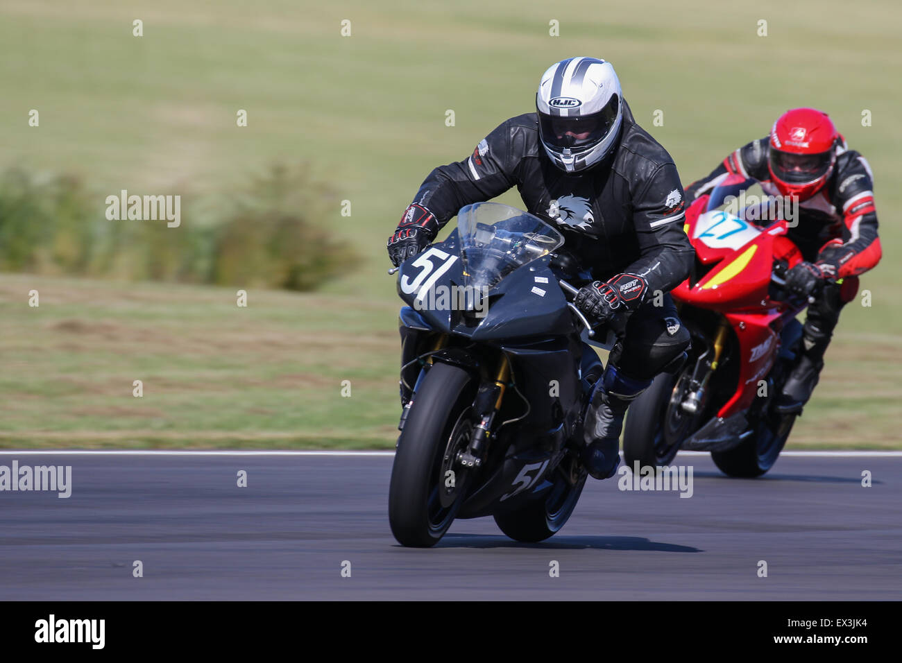 Bikers racing around Castle Combe Circuit for the Grand National Race ...