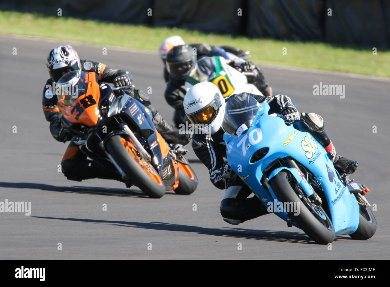 Bikers racing around Castle Combe Circuit for the Grand National Race ...