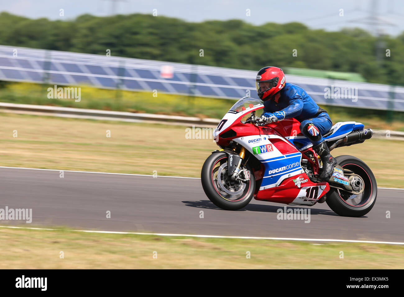 Bikers racing around Castle Combe Circuit for the Grand National Race ...