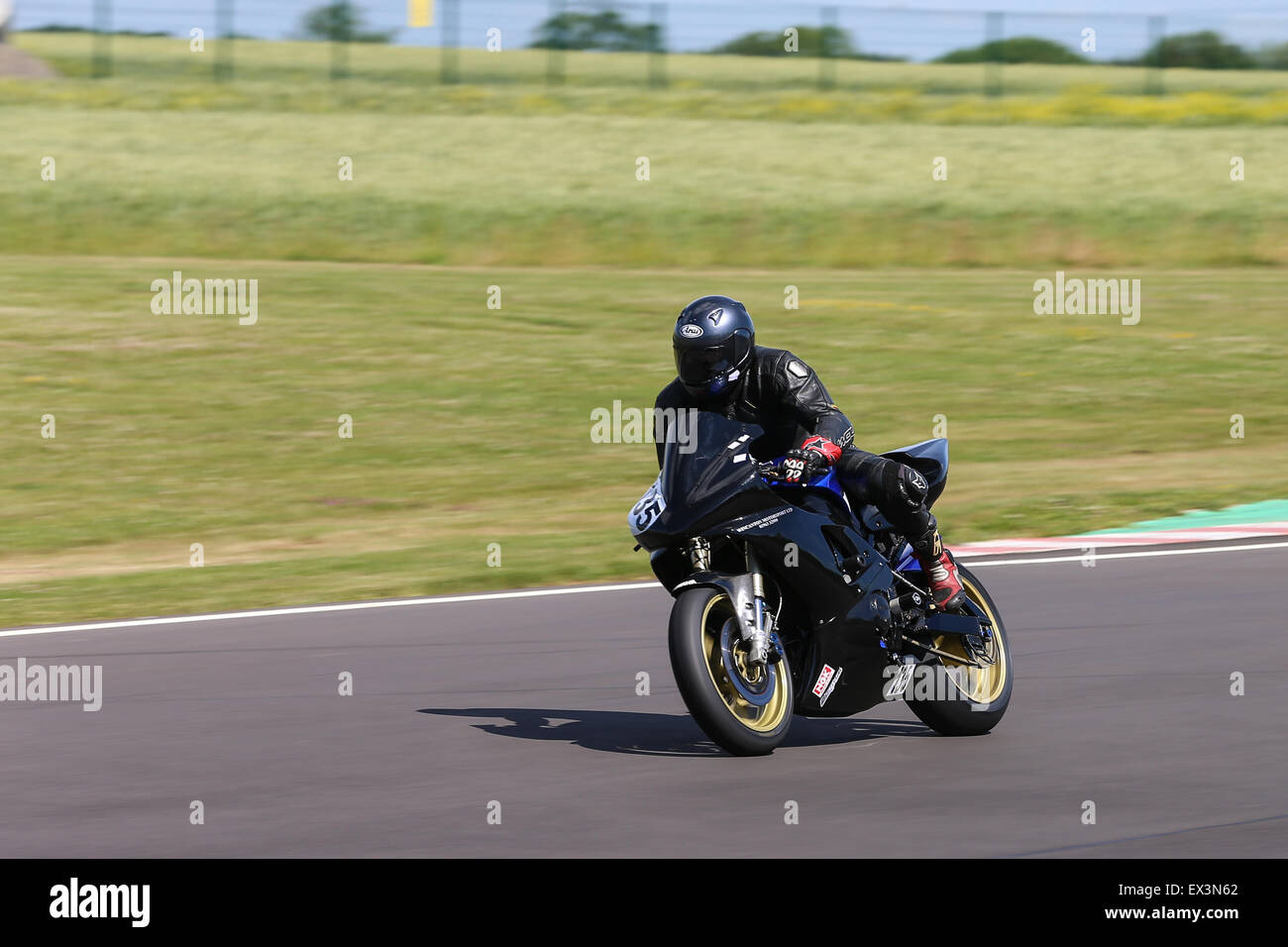 Bikers racing around Castle Combe Circuit for the Grand National Race ...
