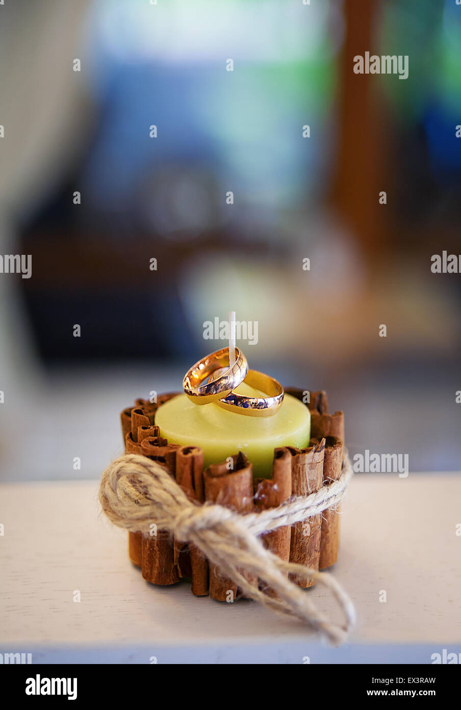 wedding rings with candle Stock Photo - Alamy