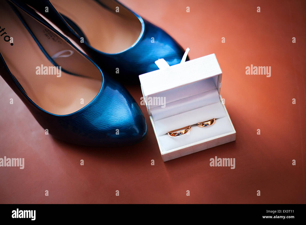 Wedding ring and black shoes Stock Photo - Alamy