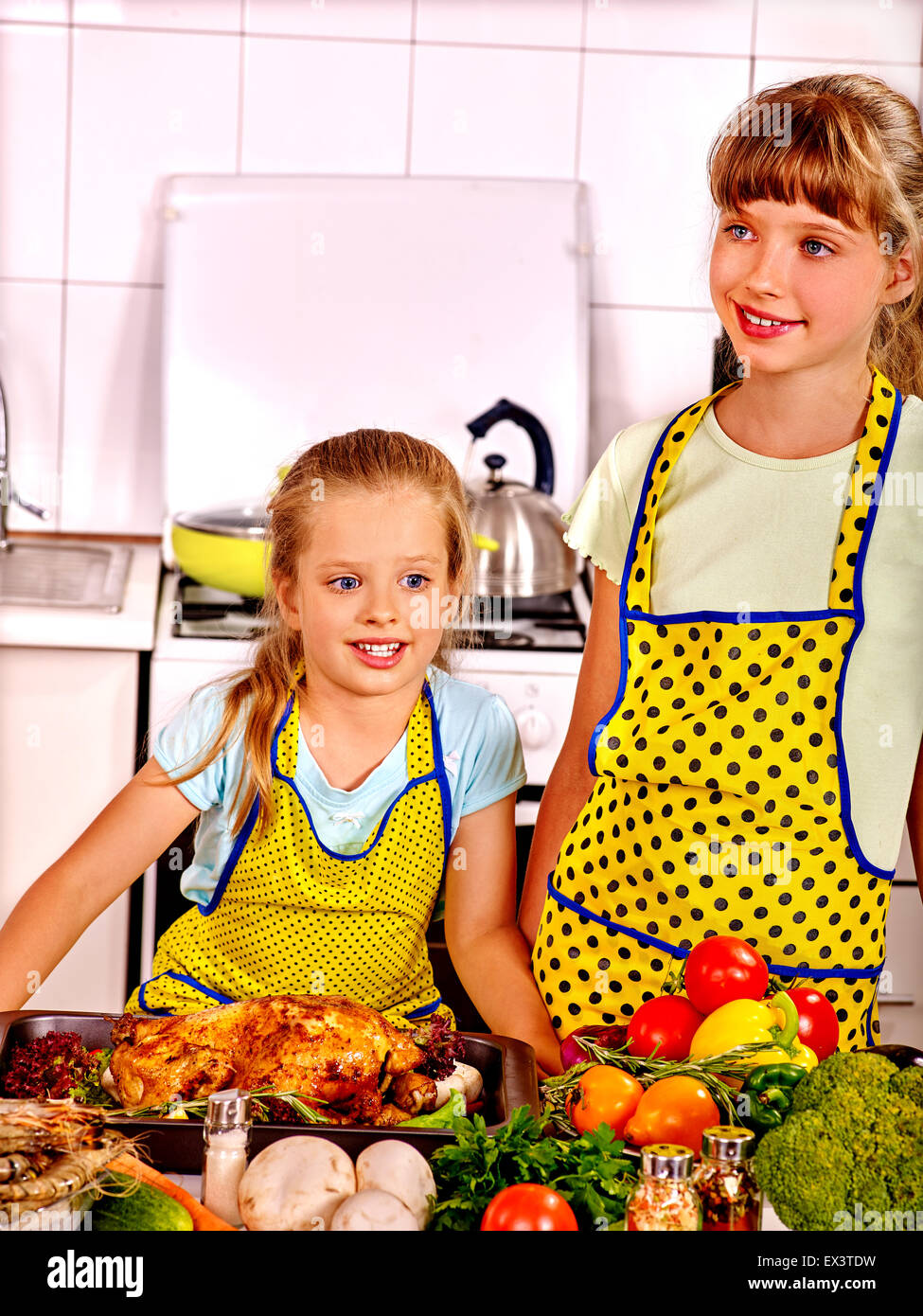 Children cooking chicken at kitchen Stock Photo - Alamy