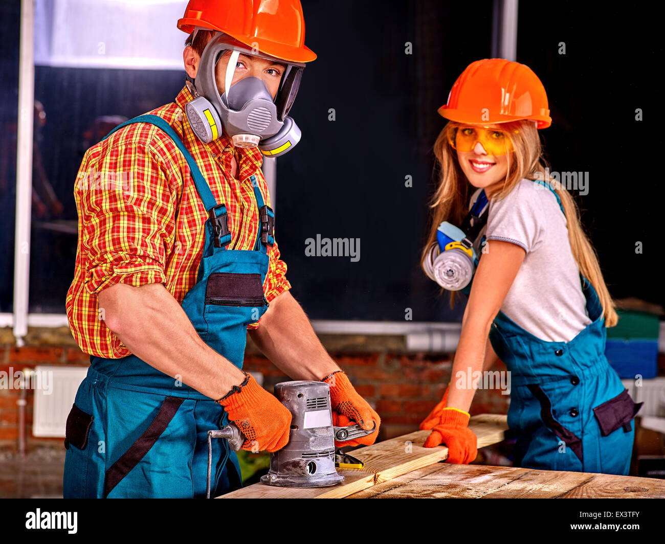 People in builder helmet Stock Photo - Alamy