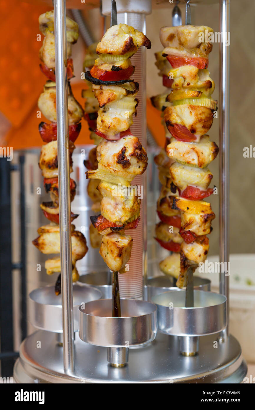 Cooking meat in a homemade electric barbeque Stock Photo - Alamy